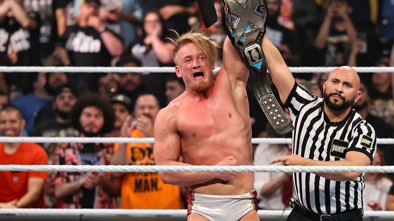 Wwes Ilja Dragunov Shows Off Nxt Championship In Signature Style